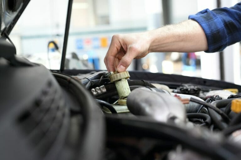 What To Do When Pink Fluid Is Leaking From Your Car