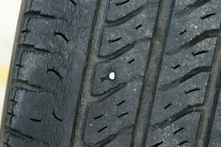 Nail In My Tire But Not Flat (What To Do & Is It Safe?)